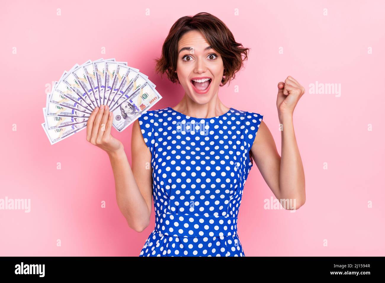 Photo of hooray millennial brunette lady hold money wear blue blouse ...