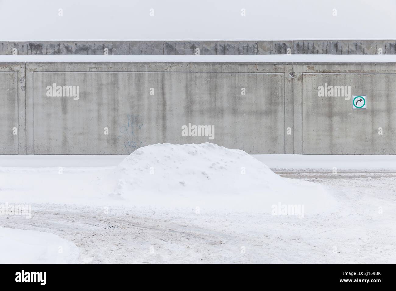 A pile of cleared snow in a car park in Longueuil, Quebec, Canada Stock ...