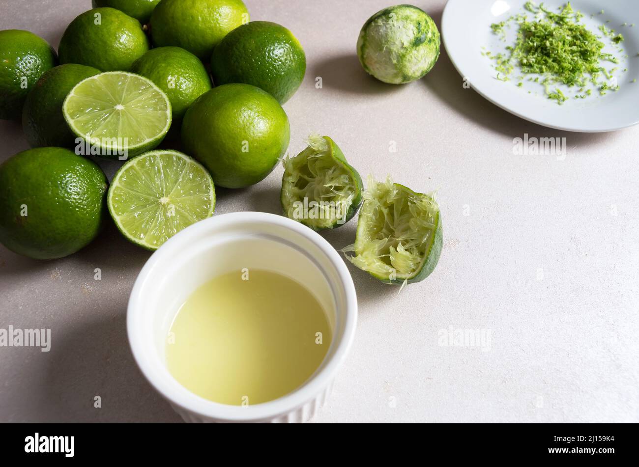 Several lemons on a white background and one fruit divided showing the ...