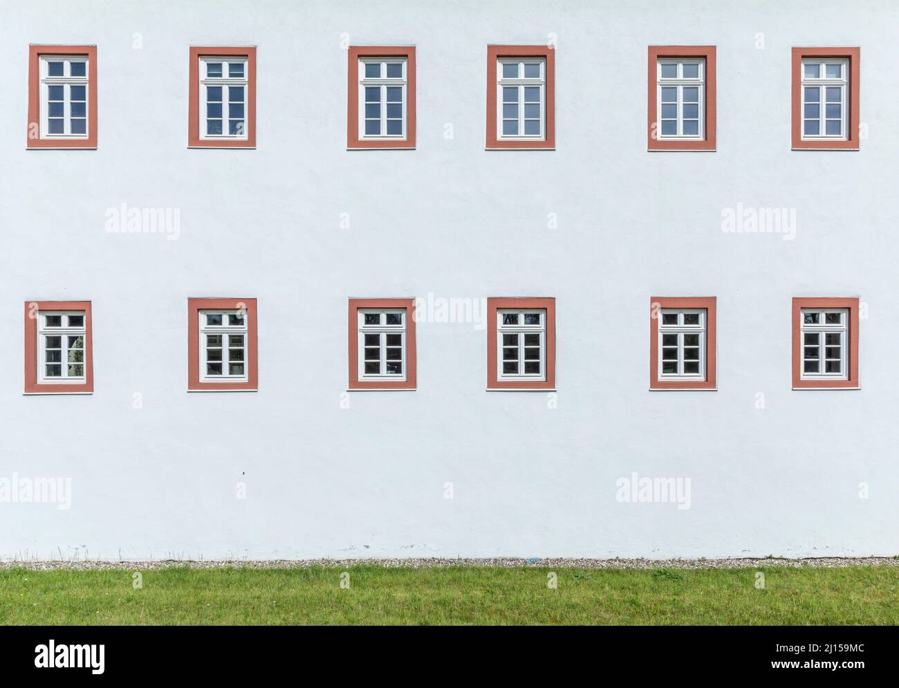 historic windows with red sandstone as harmonic background Stock Photo ...