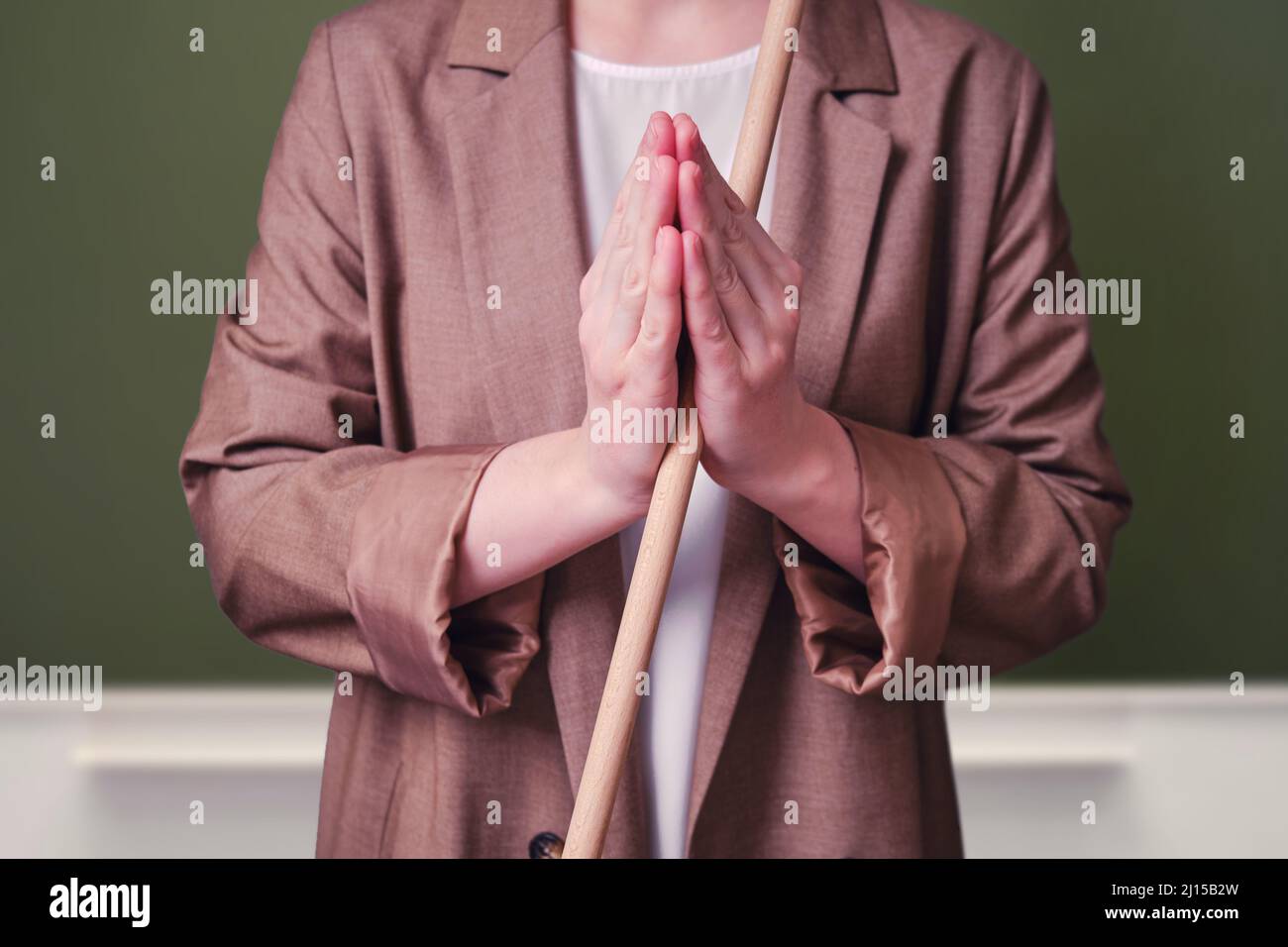 Woman teacher folded her hands in prayer gesture on school blackboard ...