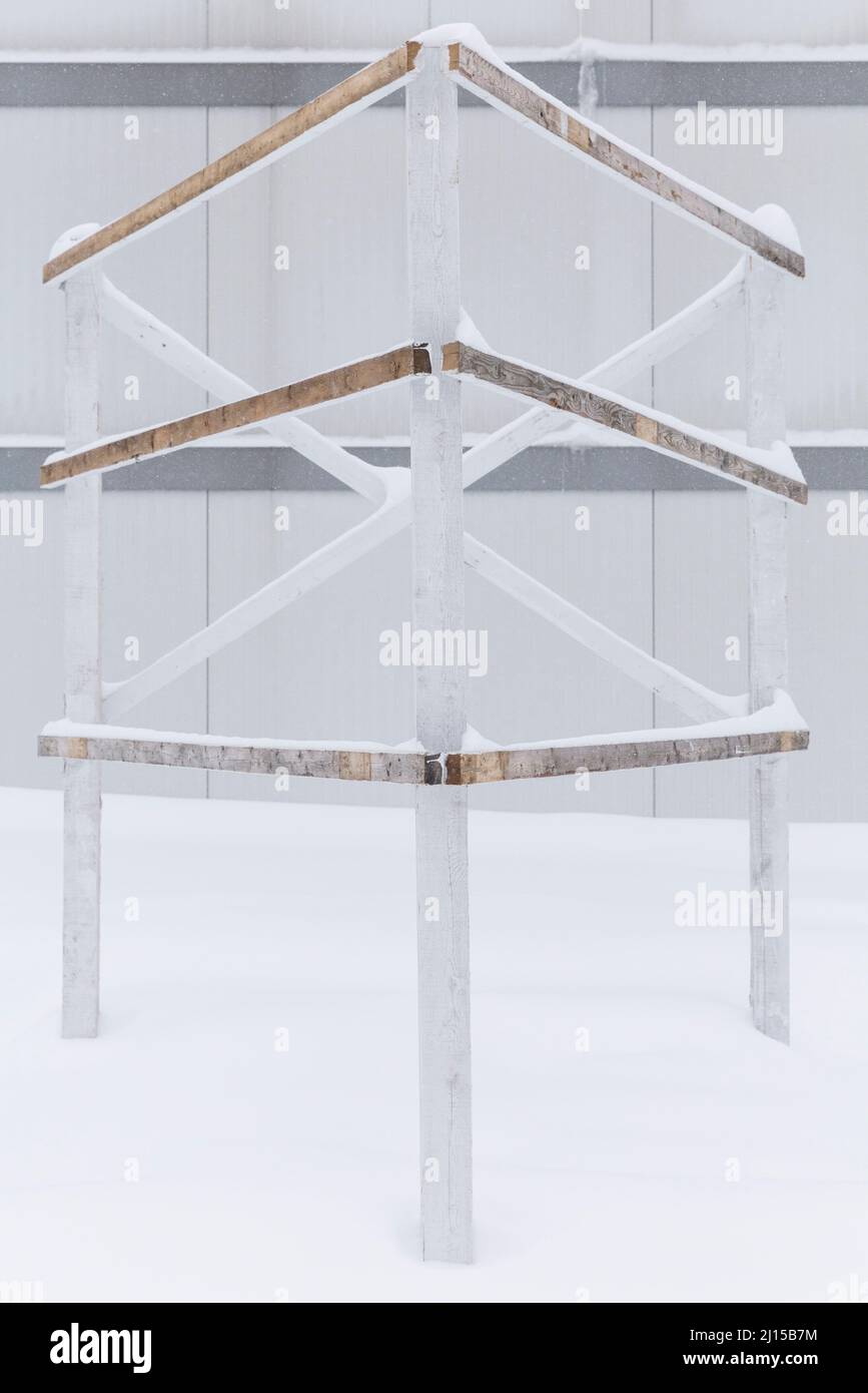 An empty framework in the snow outside a building in Longueuil, Quebec ...