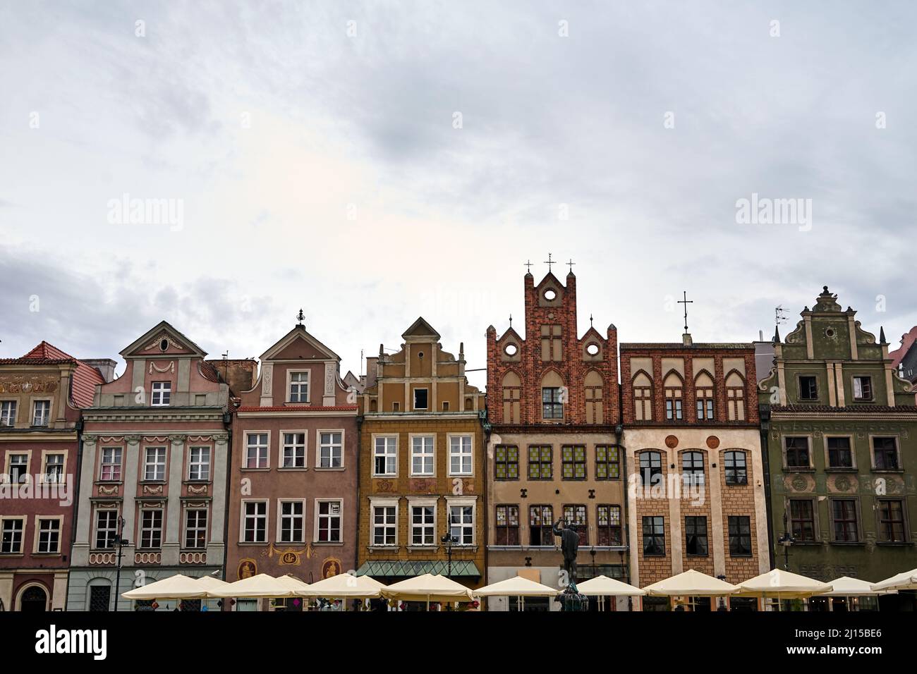 facades of historic tenement houses restaurant umbrellas on the market ...