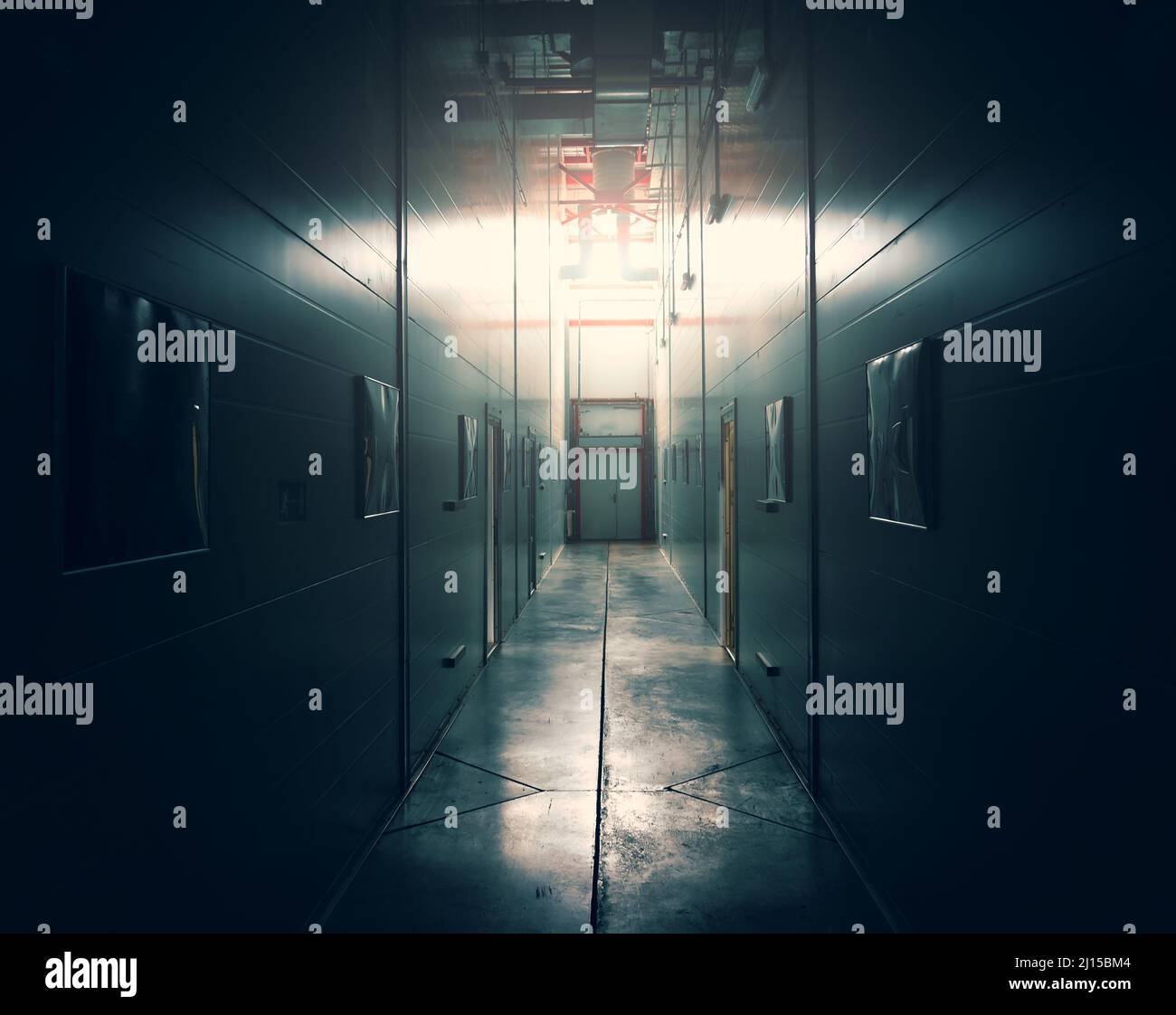 Dark corridor with closed door in end and light from window Stock Photo ...