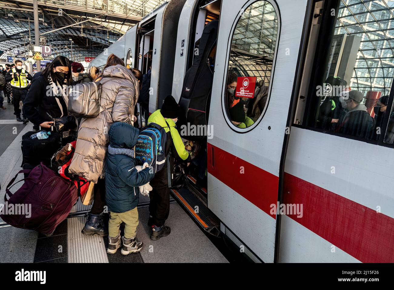 A family of Ukrainian refugees getting ready to board a train on the ...