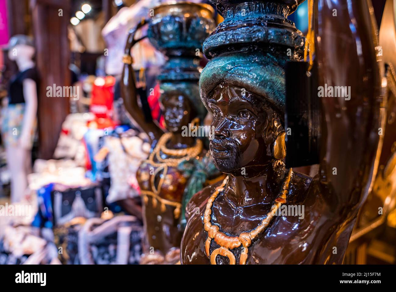 Antique statue as gift display on souvenirs stand at shop for sale ...