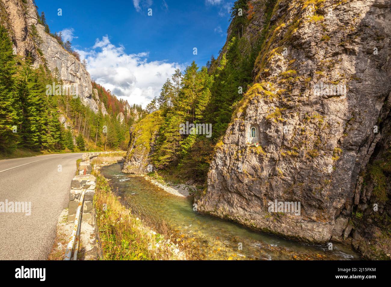 Road through a rocky gorge in a mountain valley at autumn. The Vratna ...