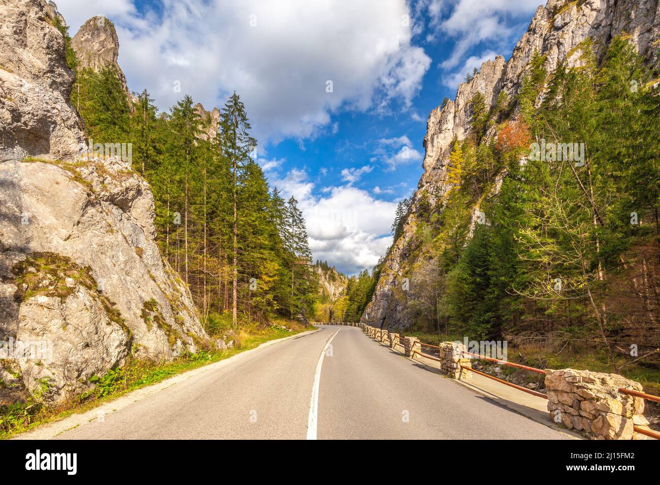 Road through a rocky gorge in a mountain valley at autumn. The Vratna ...