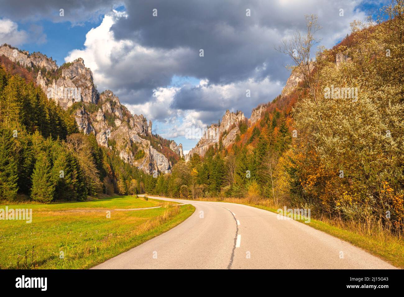 Road through a rocky gorge in a mountain valley at autumn. The Vratna ...