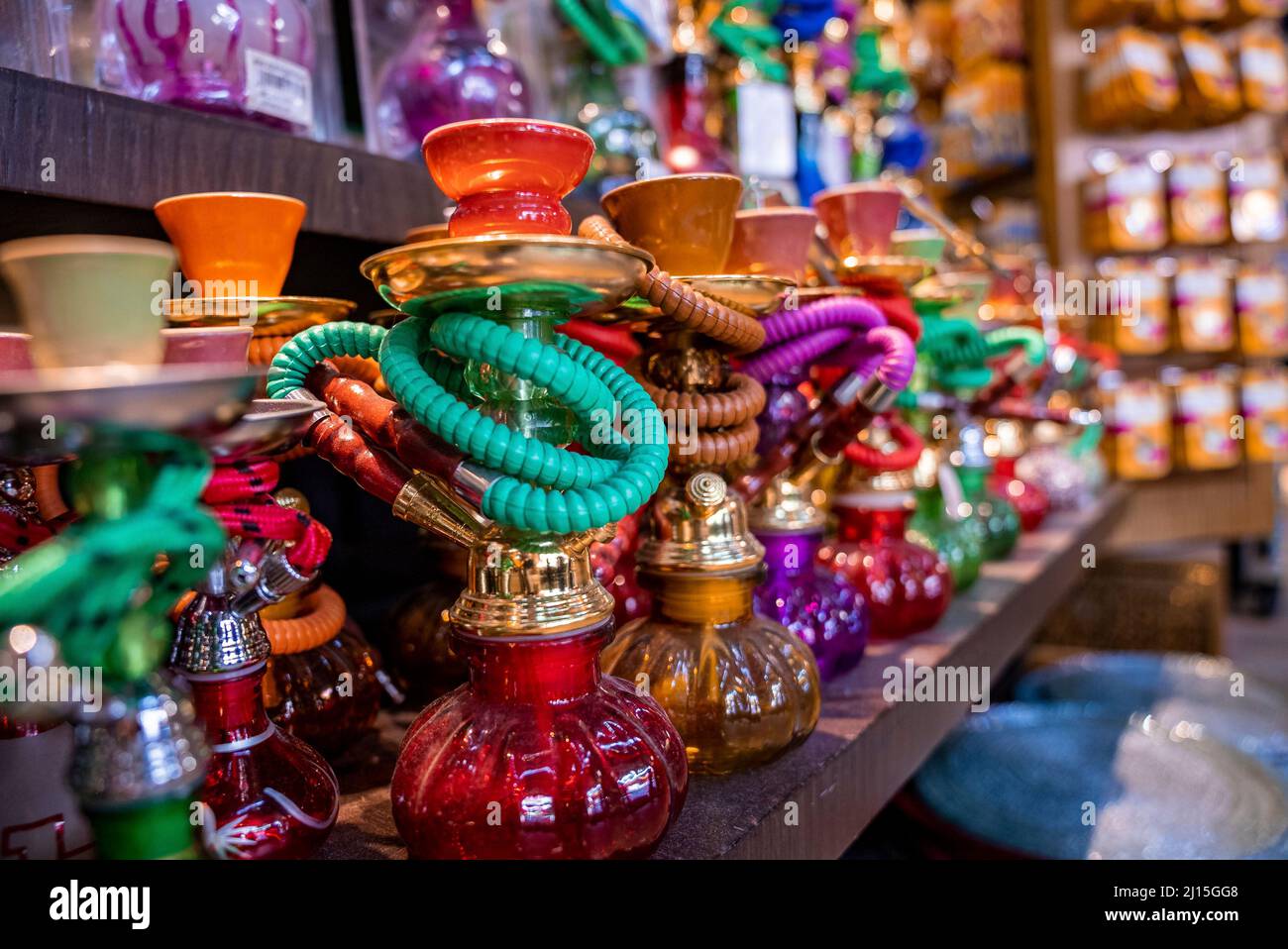 Various colorful hookahs display on souvenirs stand at market for sale ...