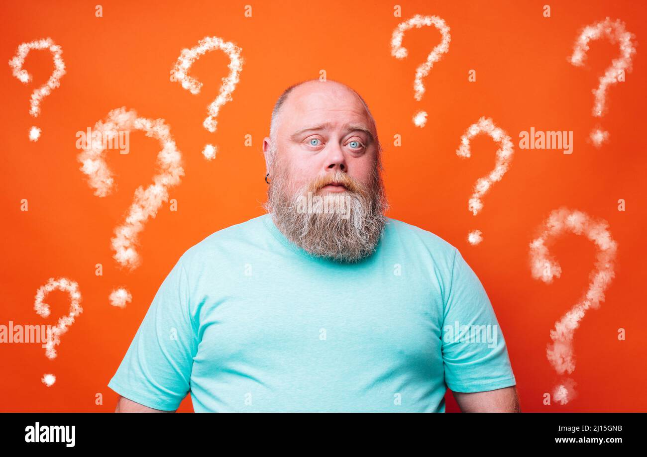 Confused man thinks something and has a lot of questions Stock Photo ...