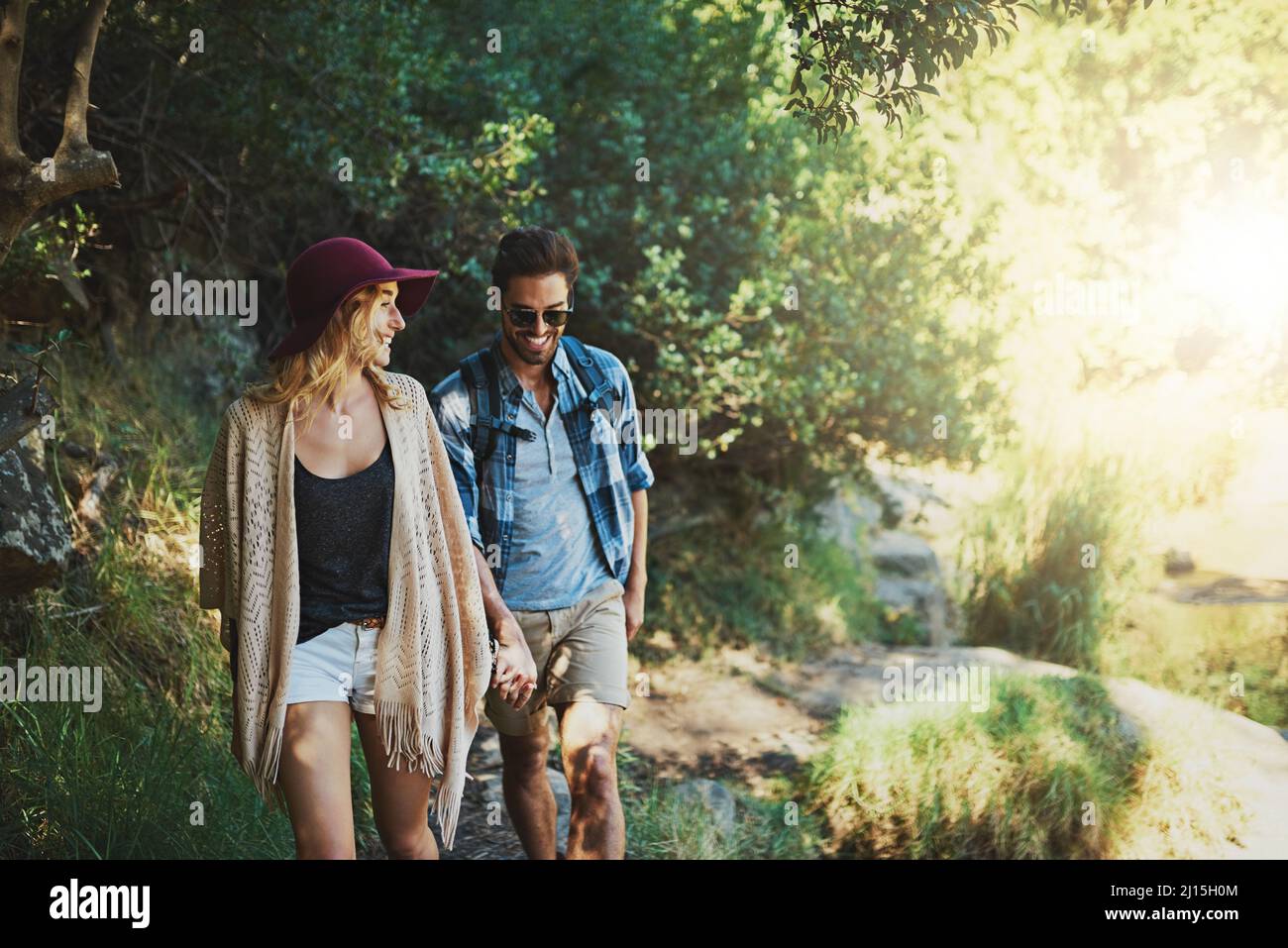 Meanderings through Mother Nature. Shot of a happy young couple ...