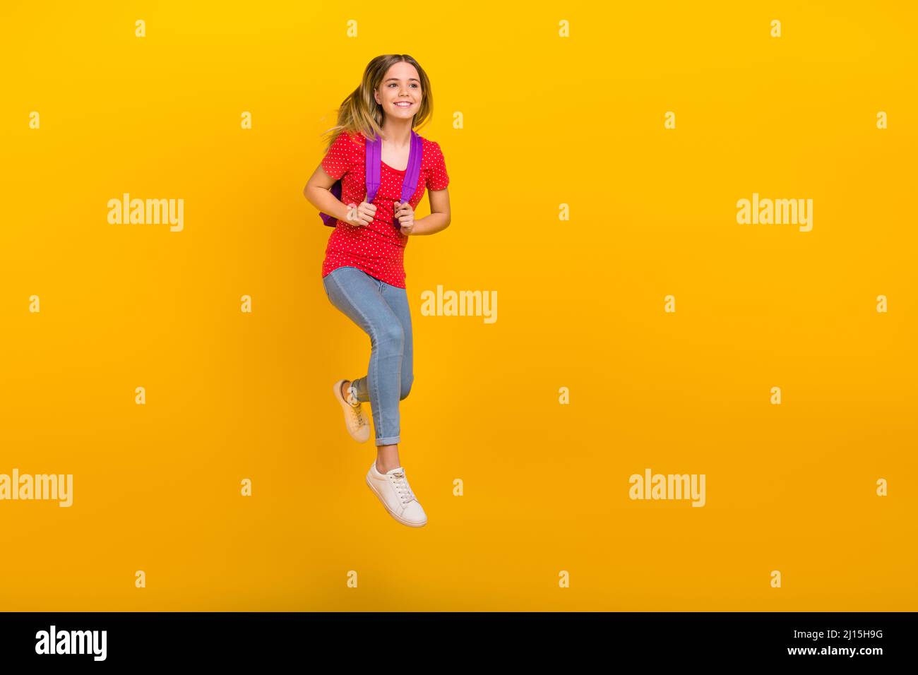 Full size photo of young pretty girl jump bag lesson look empty space ...