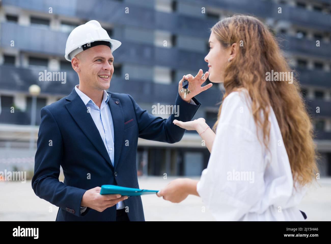 Builder giving keys to client after finishing signing contract Stock ...