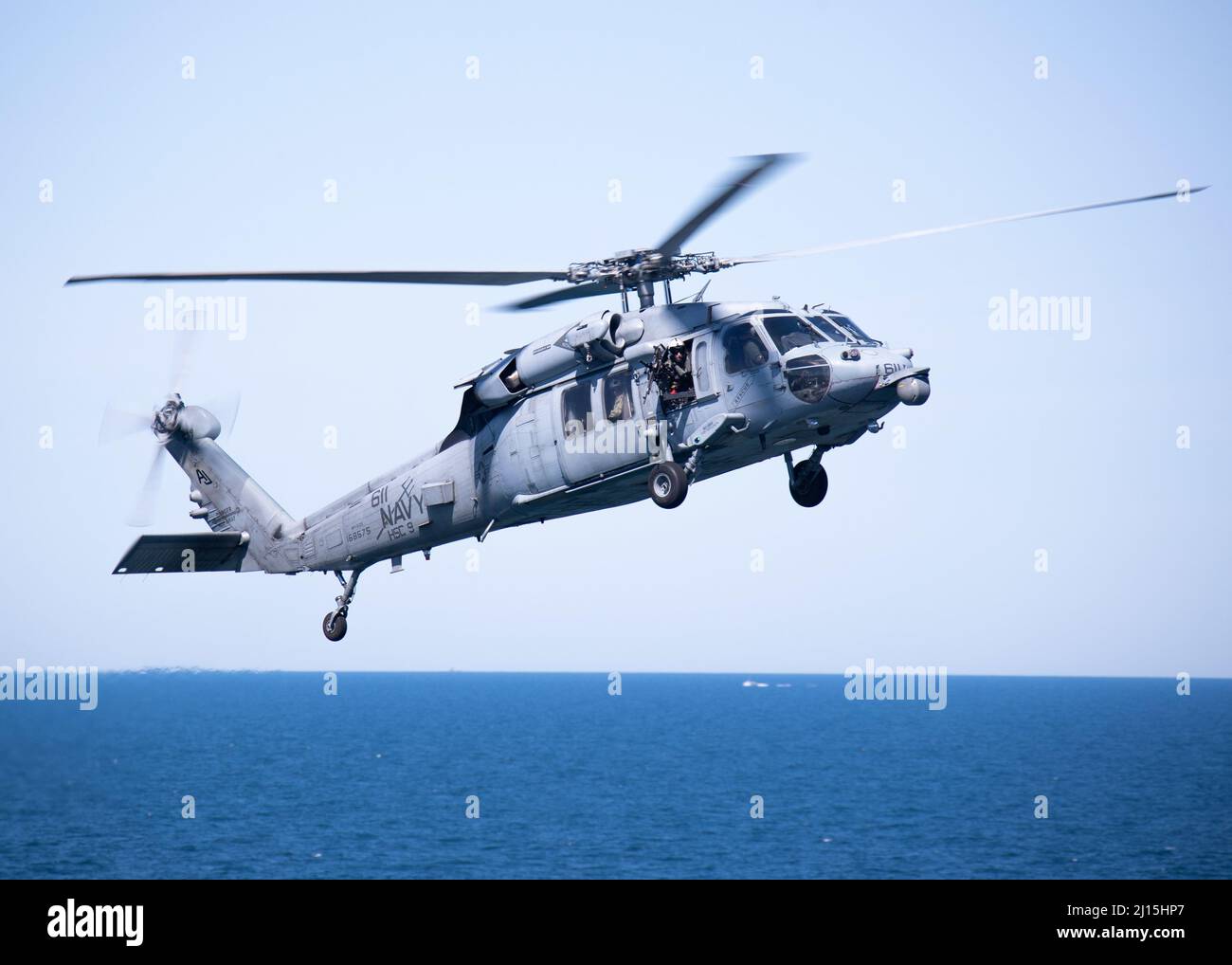 An MH-60S Nighthawk helicopter, attached to the "Tridents" of ...