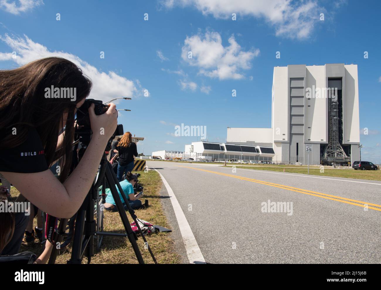 Media is seen documenting the opening of the doors to High Bay 3 of the ...
