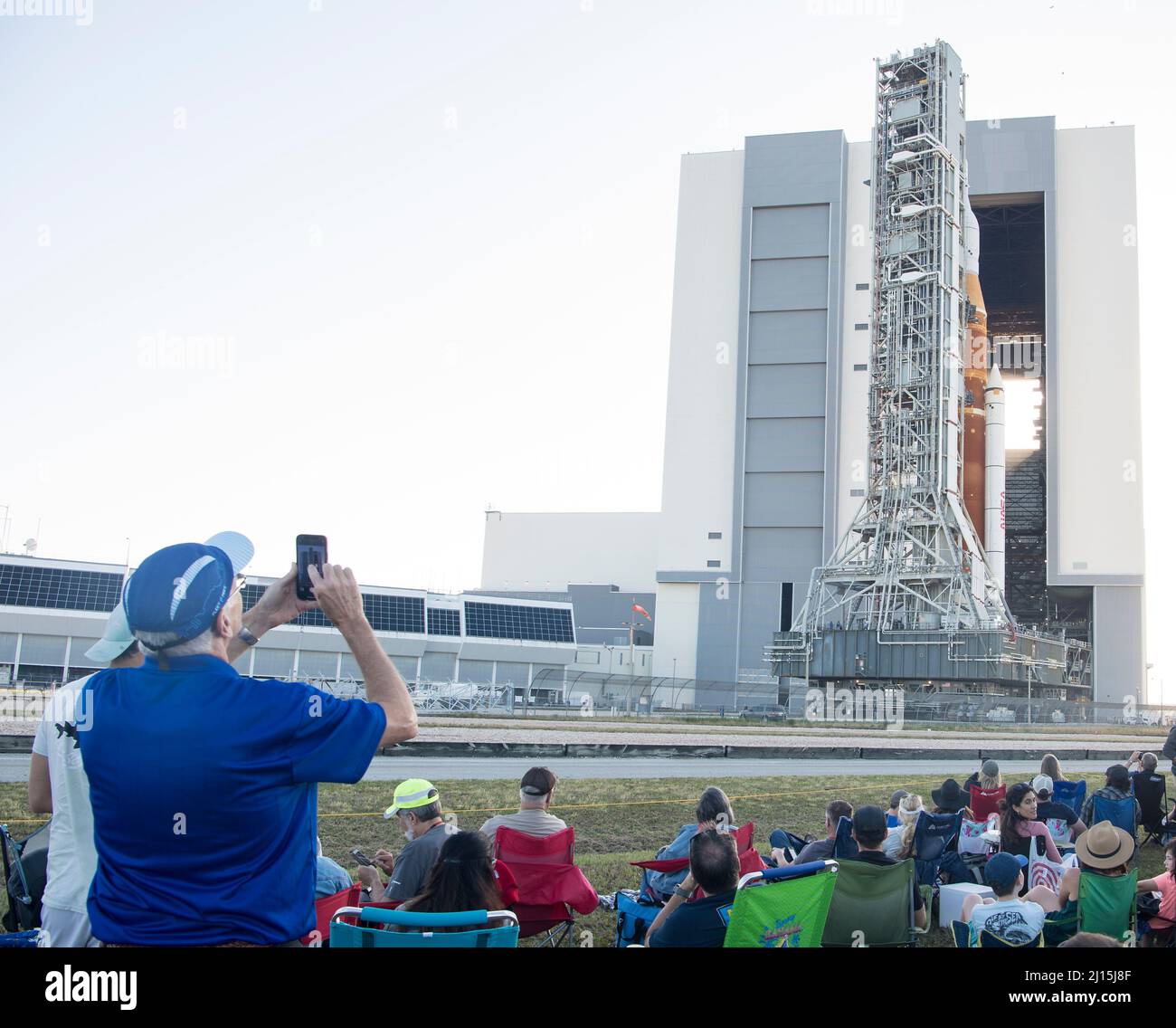 Invited guests and NASA employees watch as NASA’s Space Launch System ...