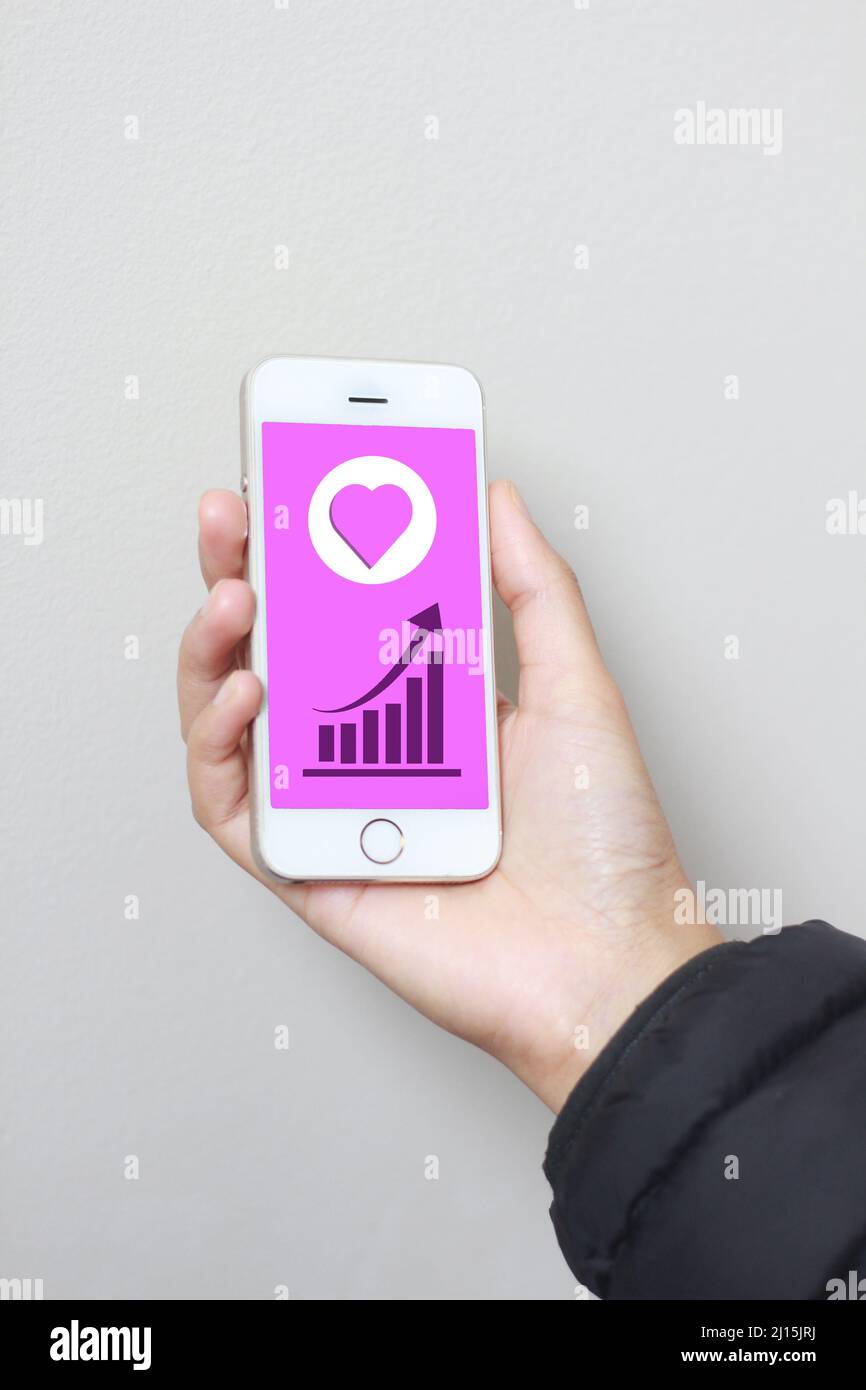 social media like screen on phone and like increase Stock Photo - Alamy