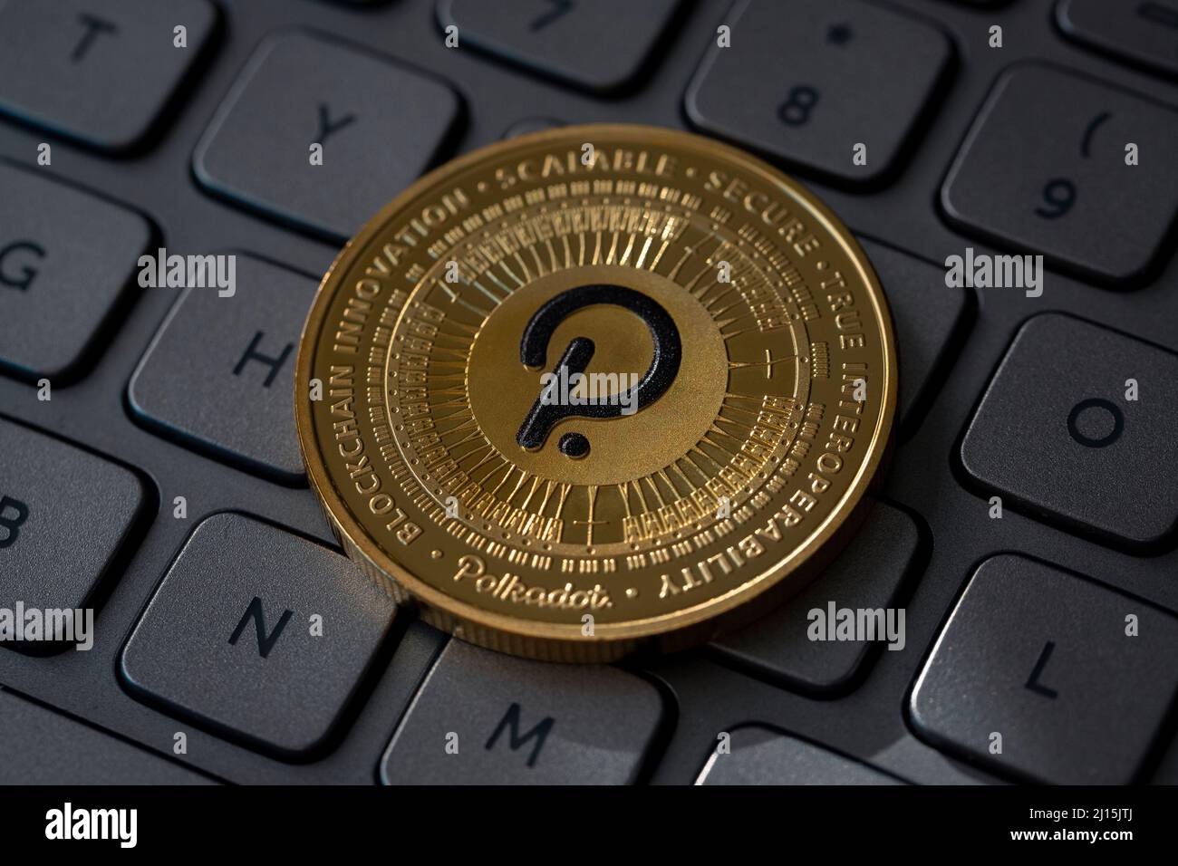 Polkadot DOT Cryptocurrency Physical Coin placed on computer keyboard ...