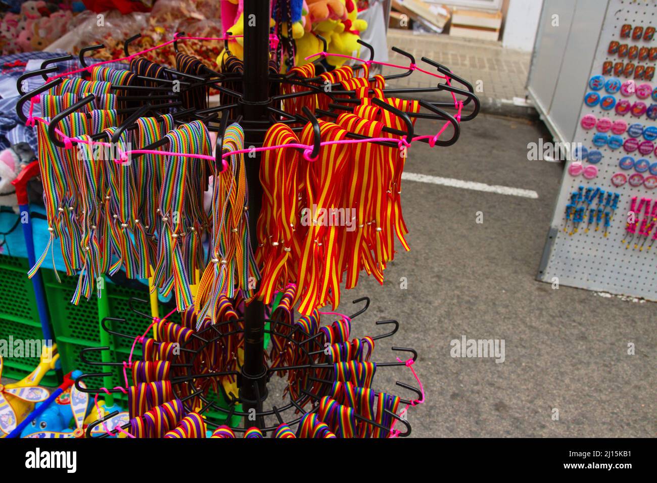 Close-up of some multi-colored bracelets that are made by hand and are ...