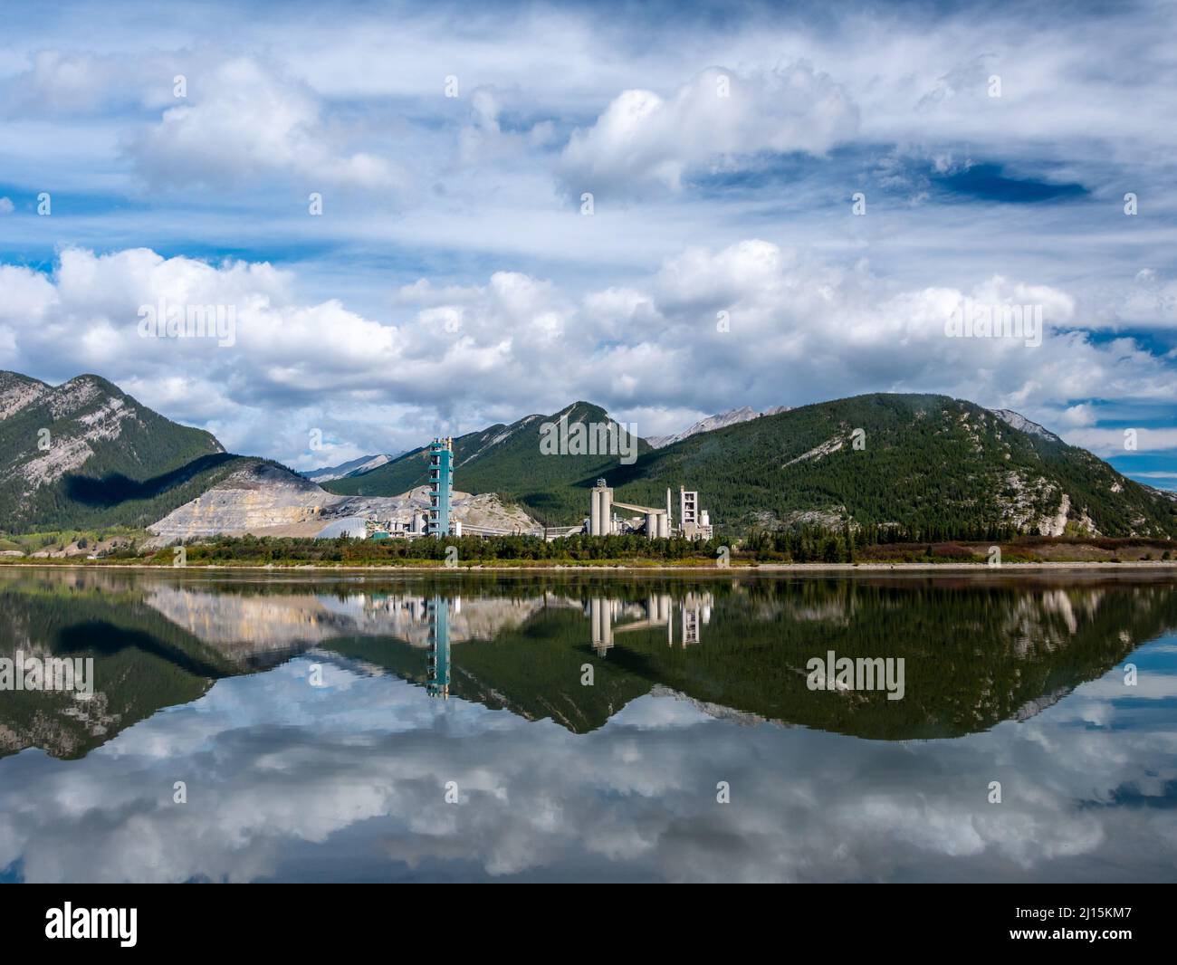 Lac Des Arcs, Alberta, Canada with a beautiful relfection and a cement ...