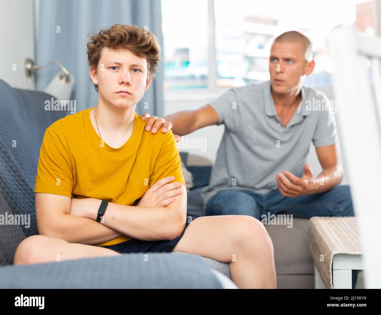 Father comforting his son Stock Photo - Alamy