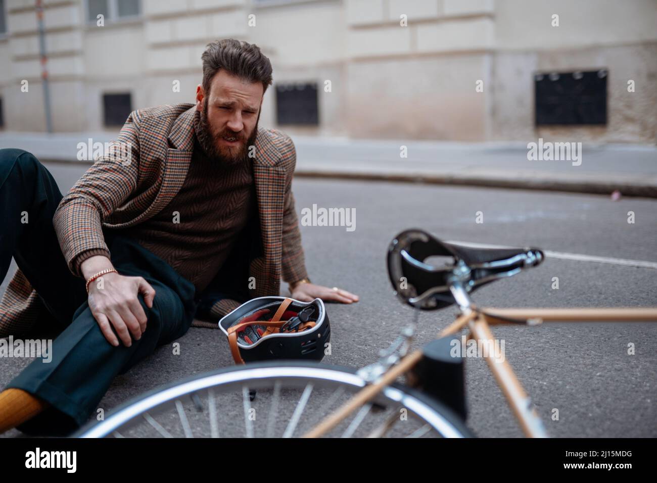 Bike accident in city. Man cyclist fall down. Bike injurie, injured ...