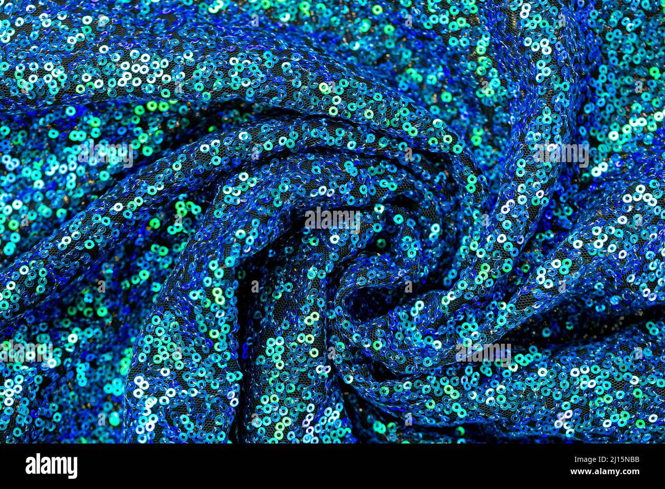 blue sequins background.Shiny blue and green fabric.Handicraft and ...