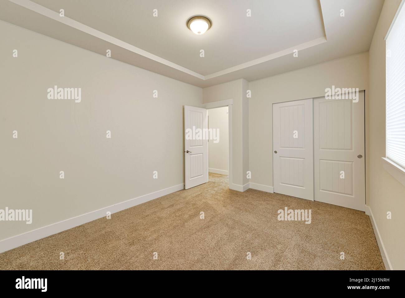 Modern residential empty bedroom interior Stock Photo - Alamy