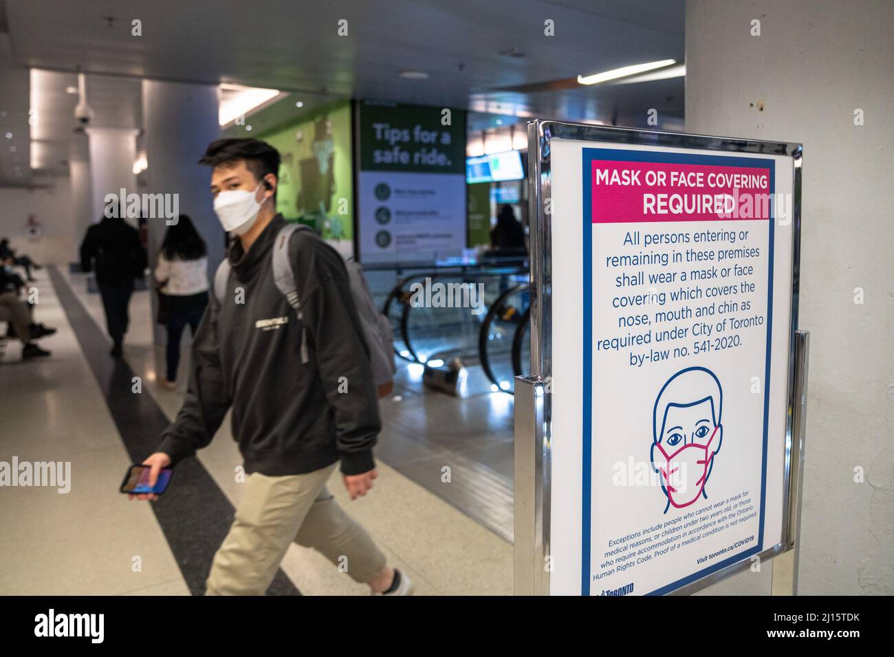 Toronto, Canada. 22nd Mar, 2022. A man wearing a face mask as a ...