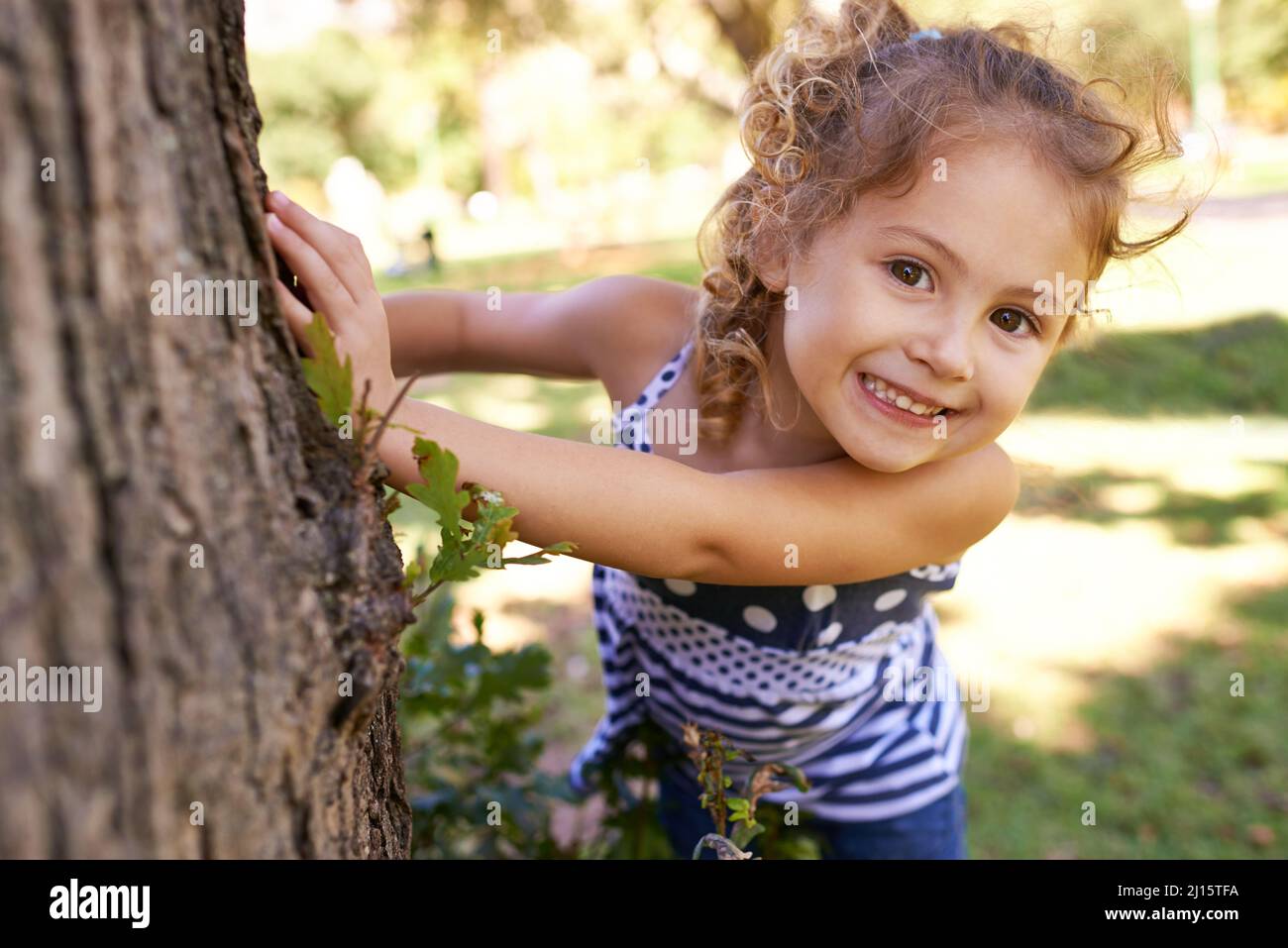Girl hiding kids hi-res stock photography and images - Alamy