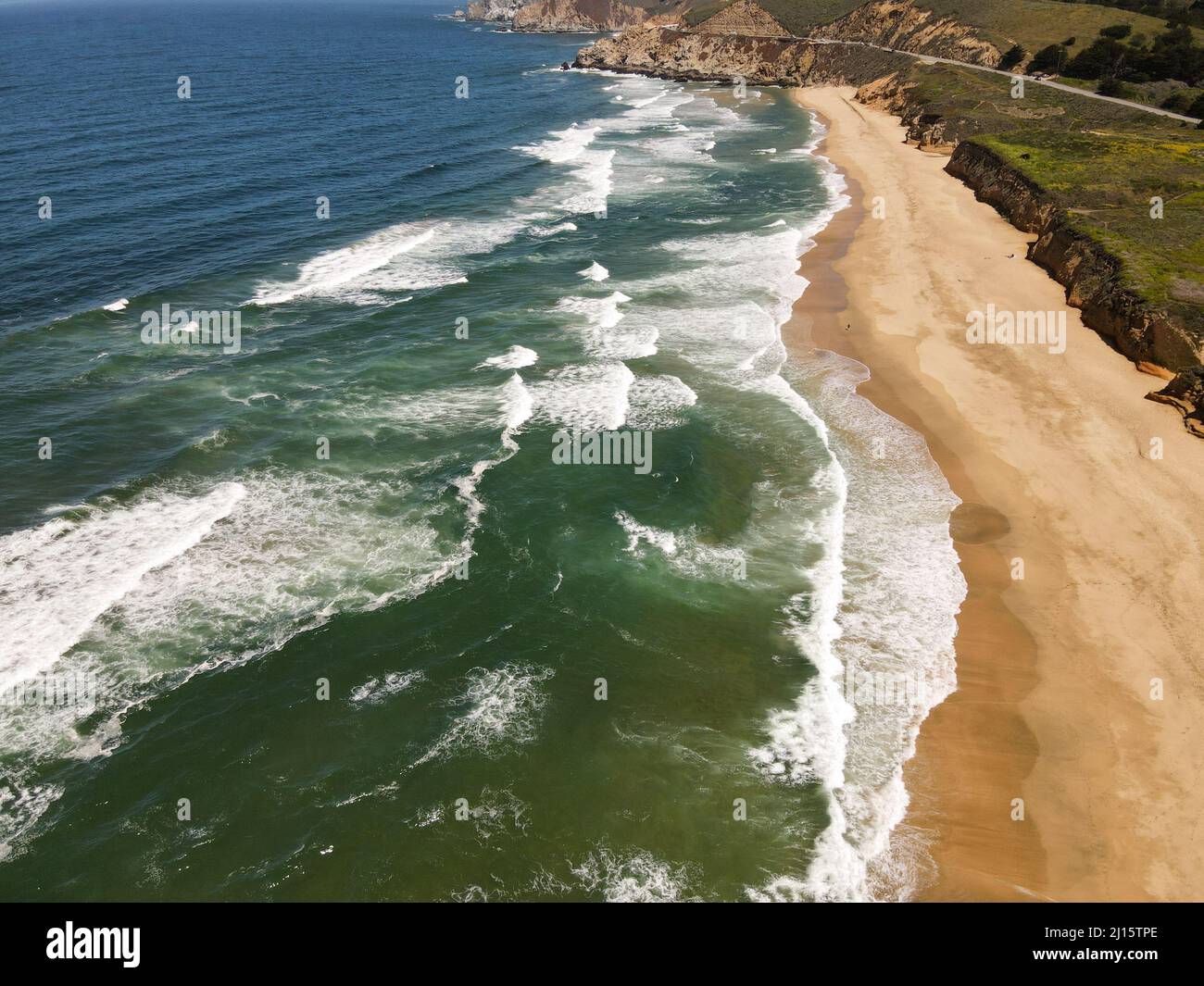 An aerial view of waves splashing the shore in California, USA Stock ...