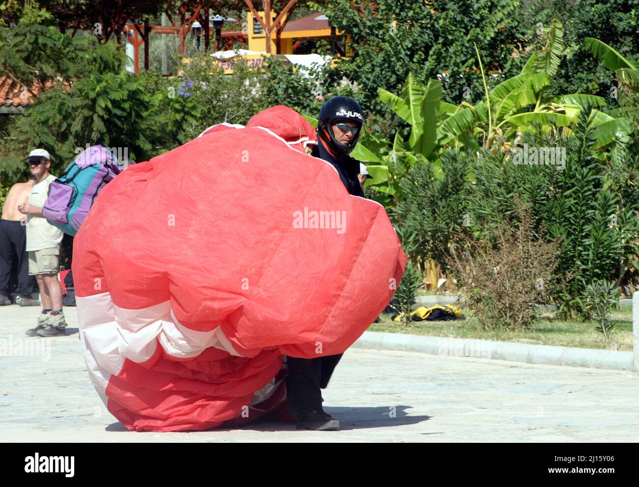 FETHIYE, TURKEY - OCTOBER 22: Paraglider carrying to parachute at ...