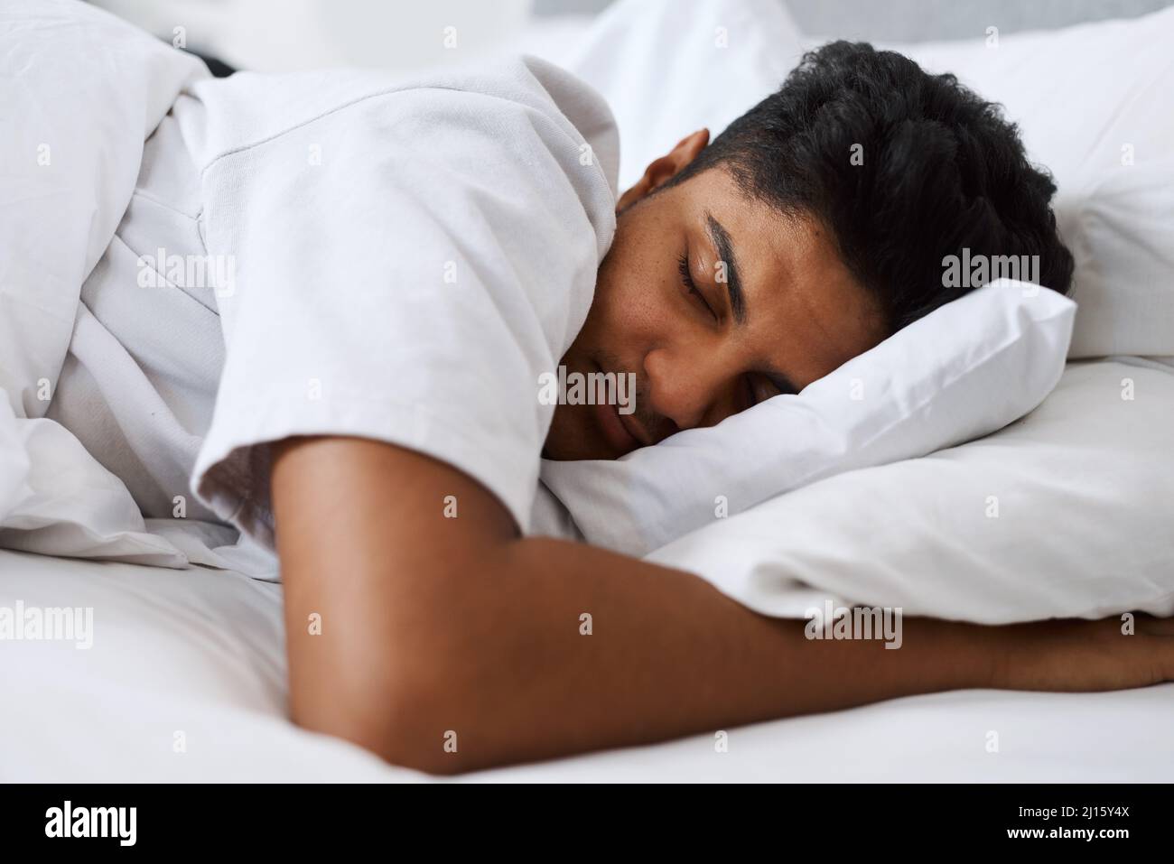Indian man sleeping in bed hi-res stock photography and images - Alamy