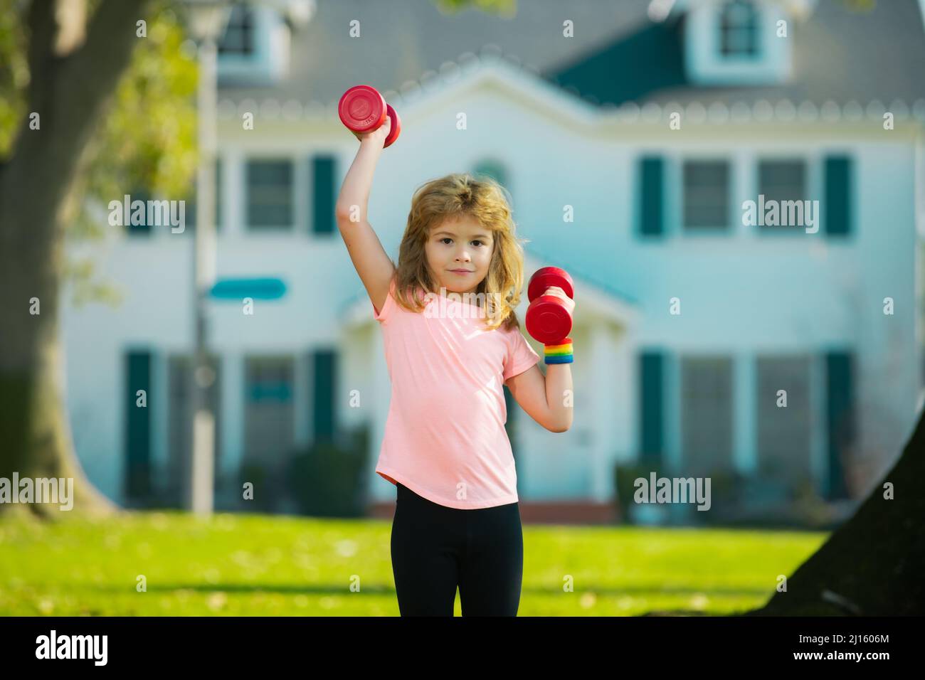 Fitness child. Cute boy workout in park. Kid sport. Child exercising ...