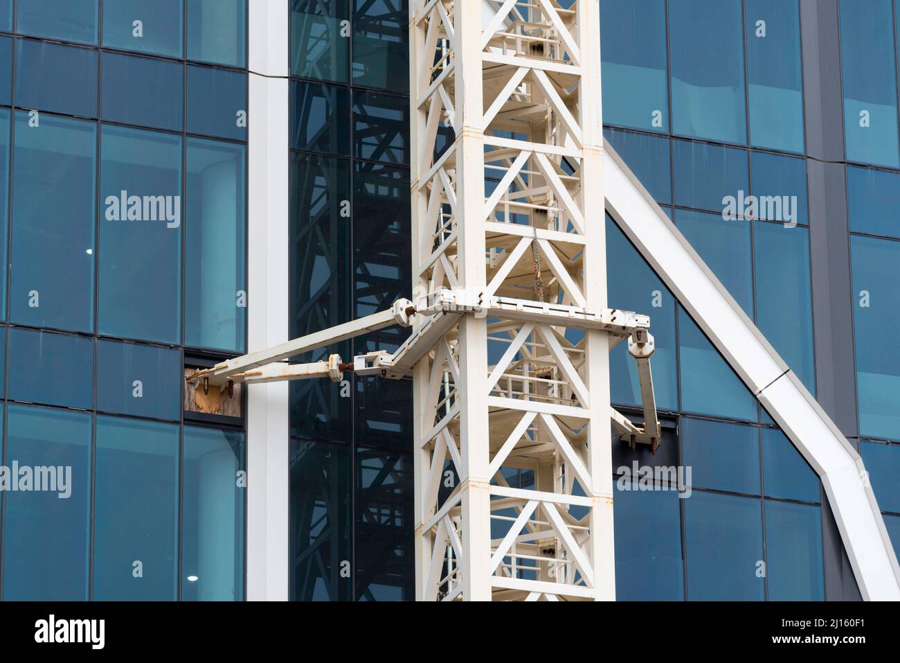 A tower crane brace or tie holds the crane steady and close to the ...