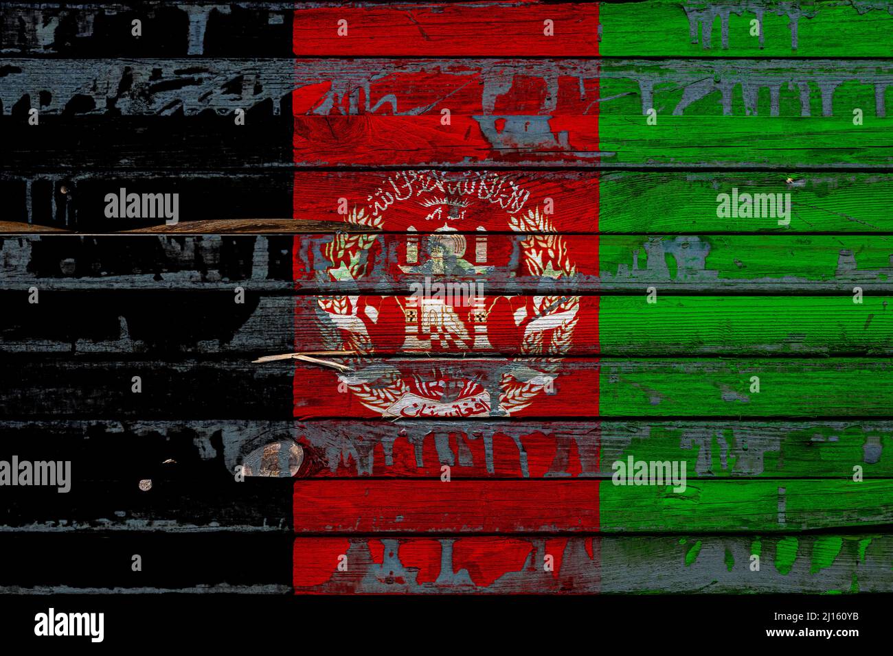 The national flag of Afghanistan is painted on uneven boards. Country ...