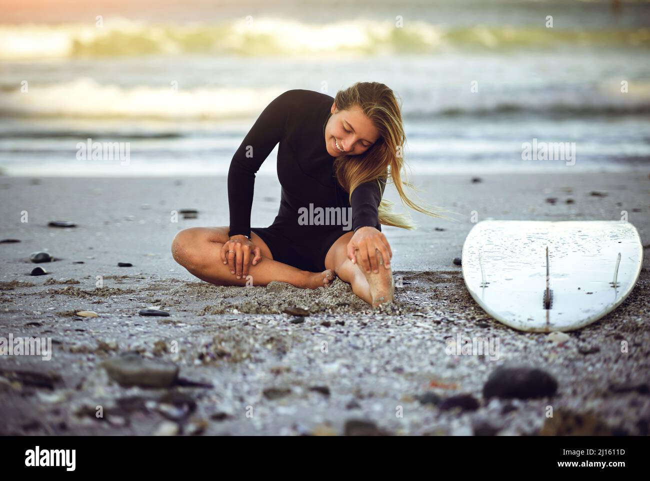 Youve gotta stretch. Full length shot of an attractive young female ...