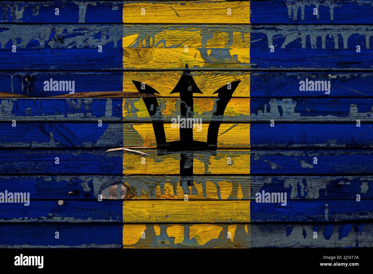 The national flag of Barbados is painted on uneven boards. Country ...