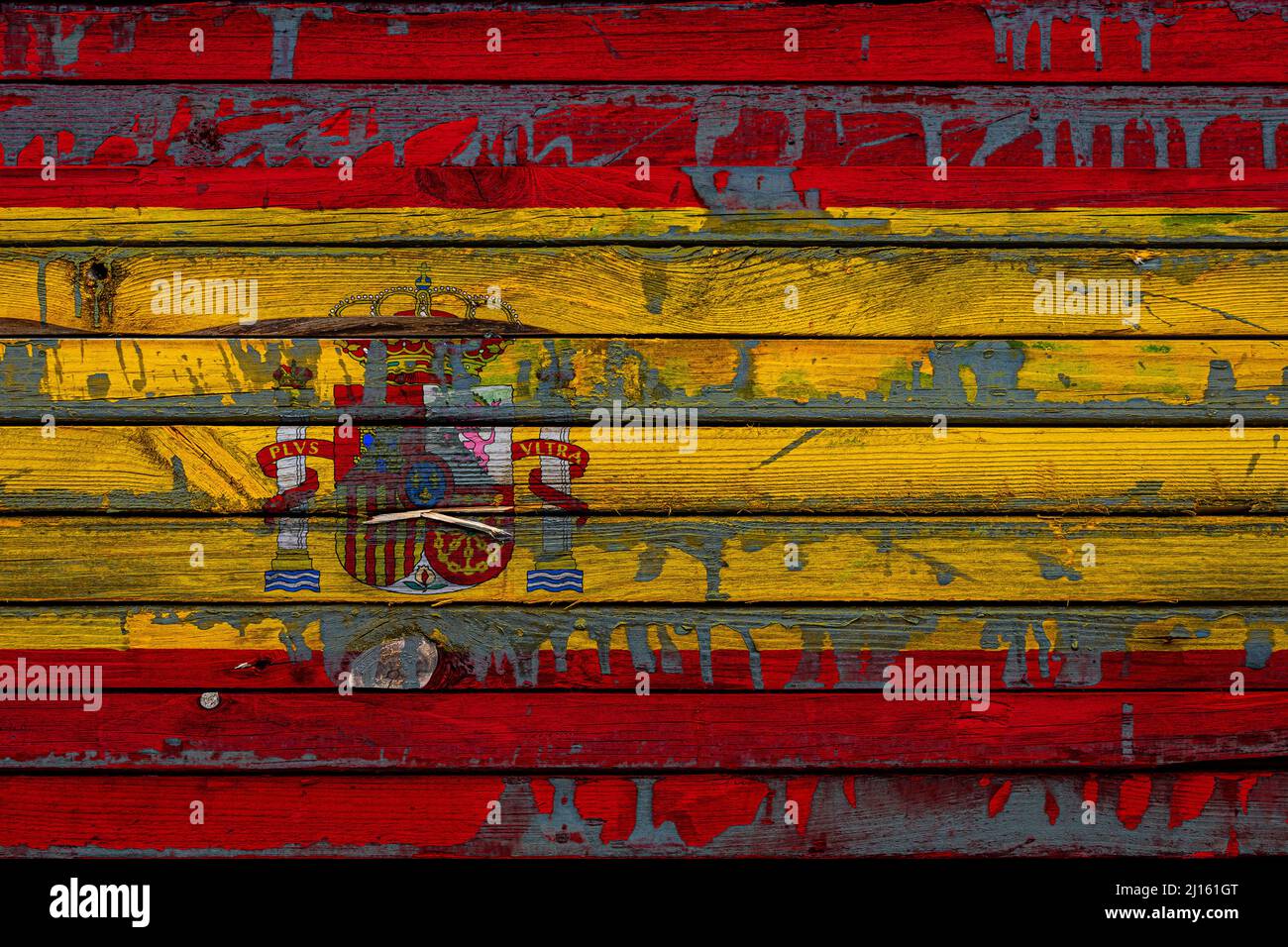 The national flag of Spain is painted on uneven boards. Country symbol ...