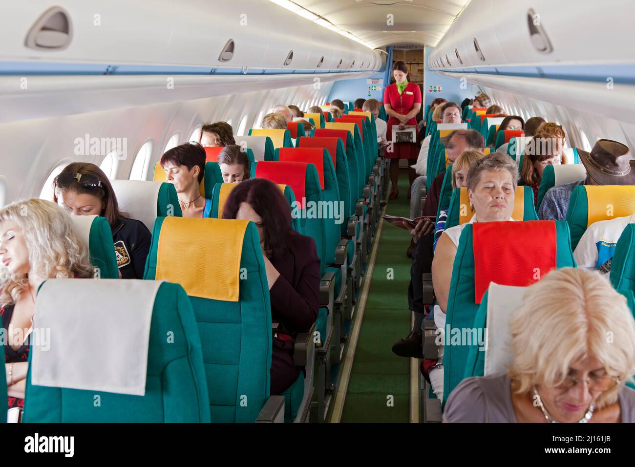 Passengers and flight attendant on flight, Austrian Airlines Stock ...
