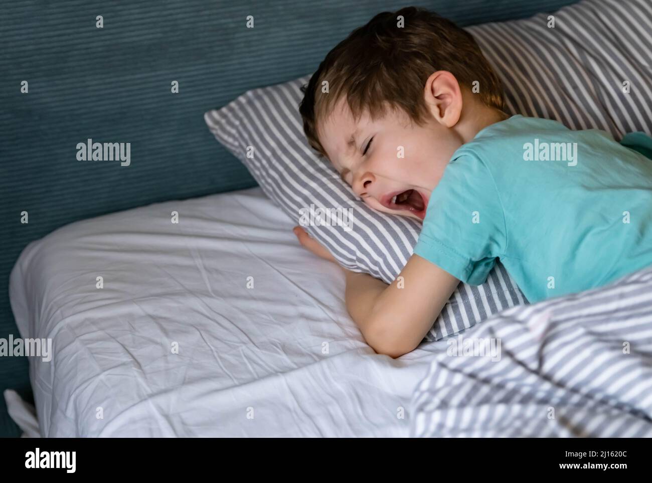 Closeup boy sleeping peacefully. Little baby napping in the nursery ...