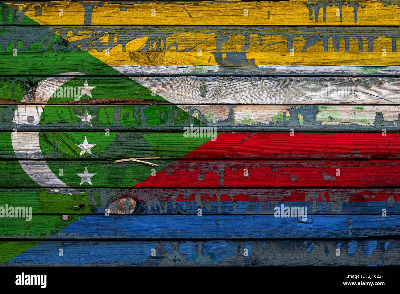 The national flag of Comoros is painted on uneven boards. Country ...