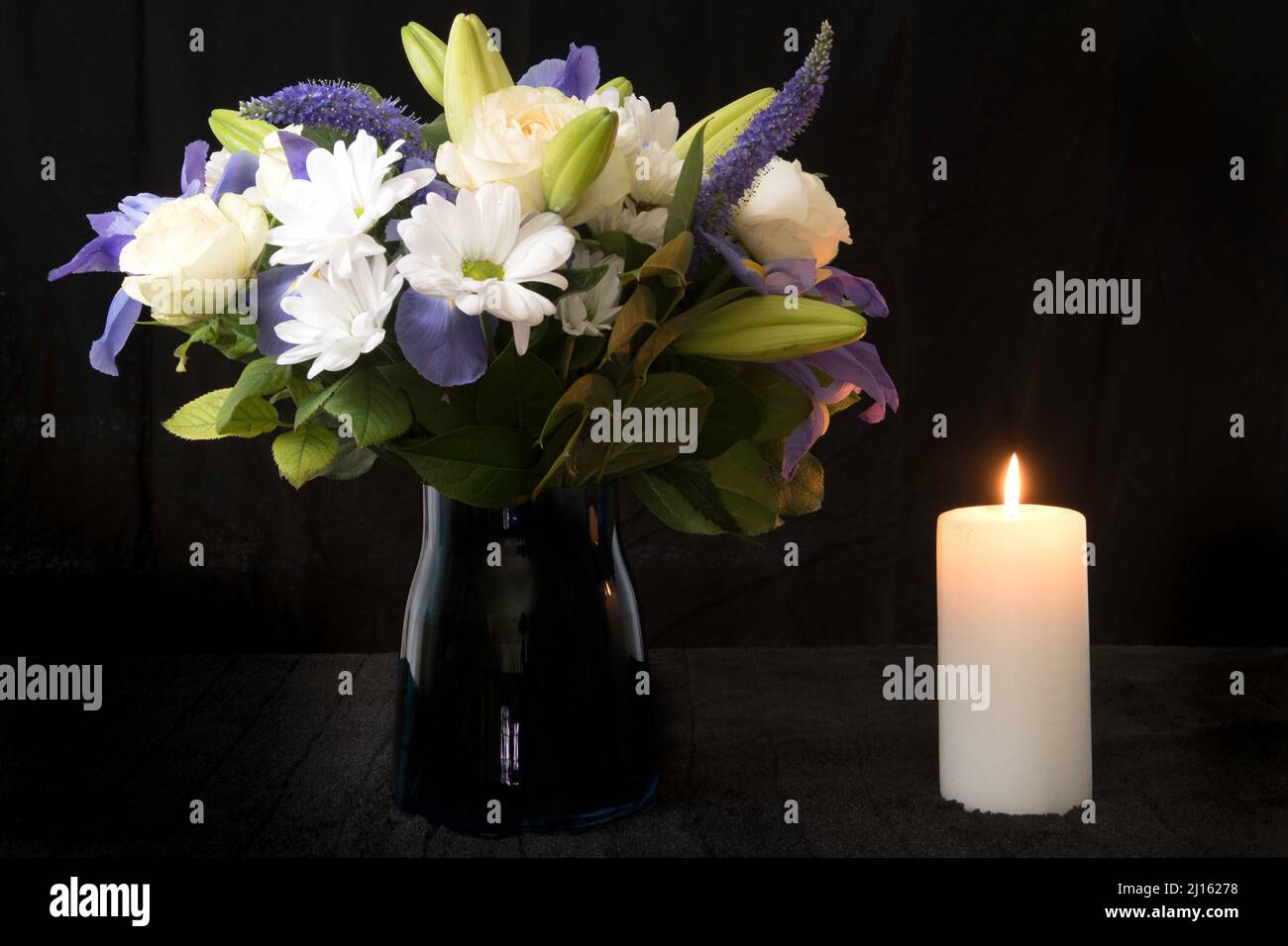 Funeral Bouquet purple White flowers and burning white candle, Sympathy ...