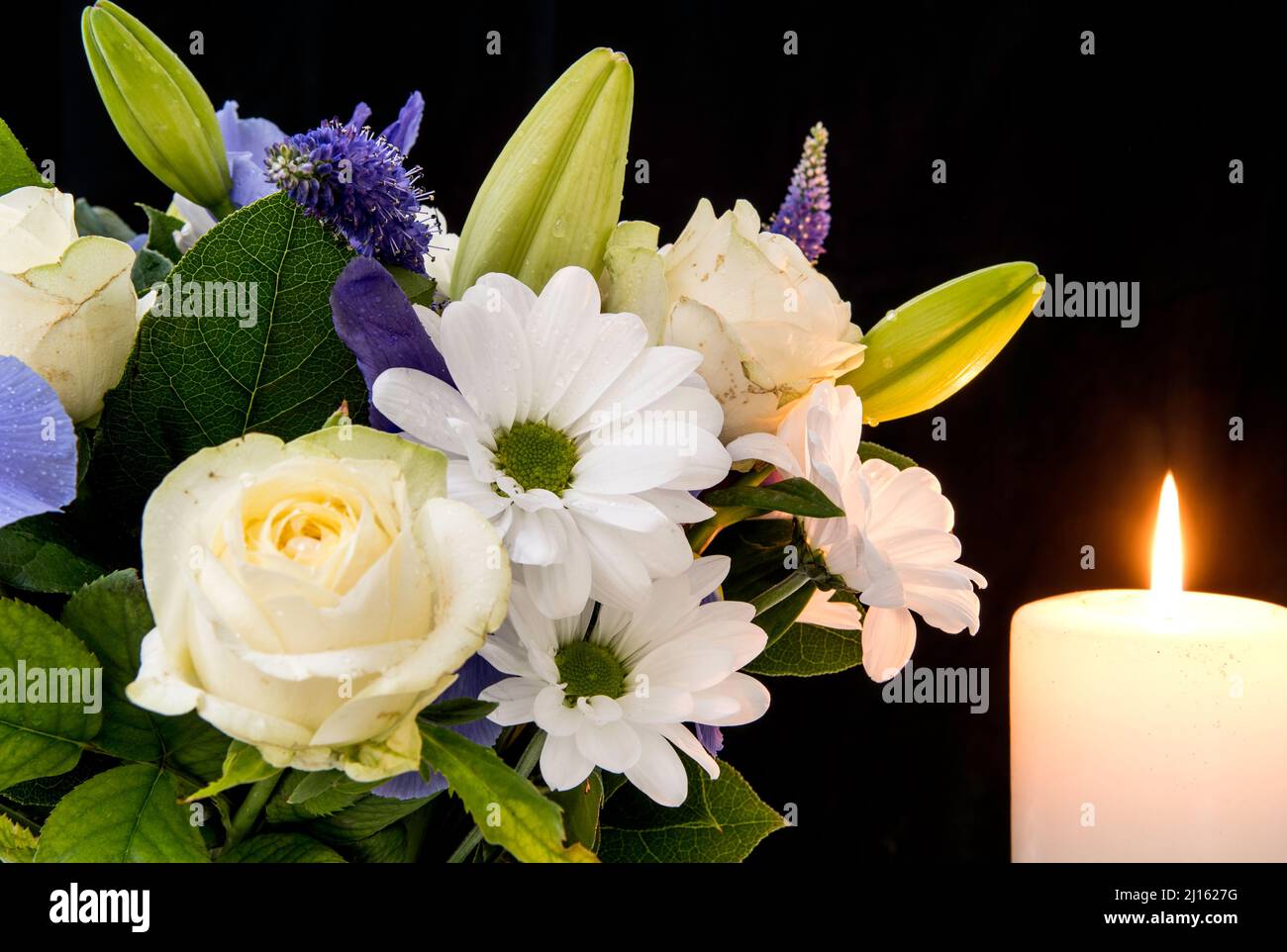 Funeral Bouquet purple White flowers and burning white candle, Sympathy ...