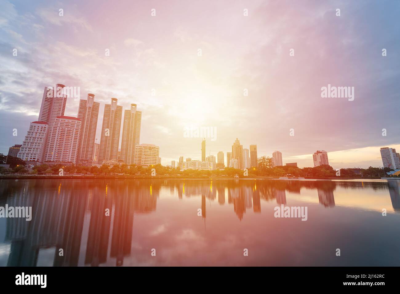 City building with water reflection before sunset background Stock ...
