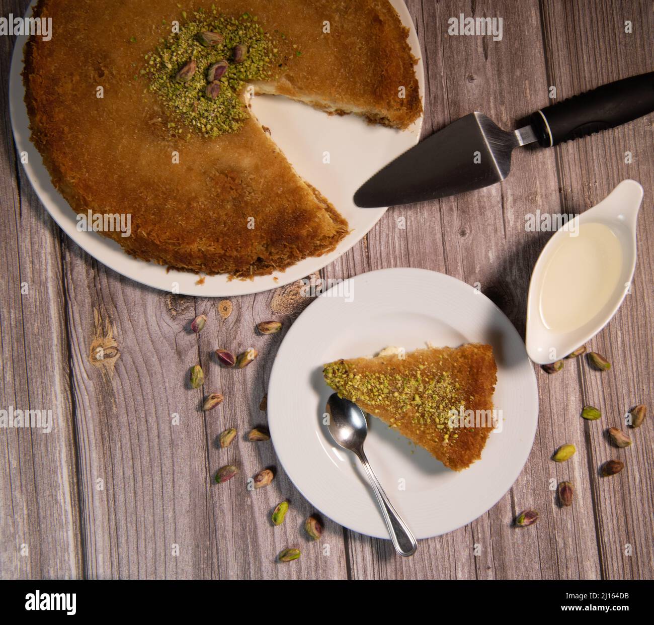 Delicious Traditional Dessert Knafeh with cheese and pistachios and ...