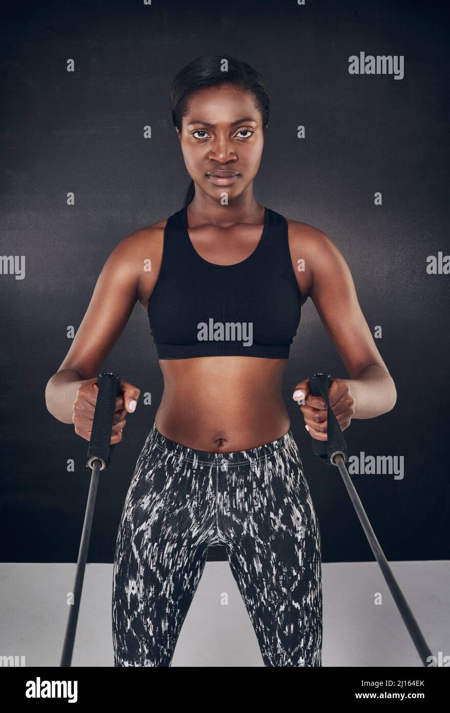 Fit is the only option. Studio shot of a beautiful young woman working ...