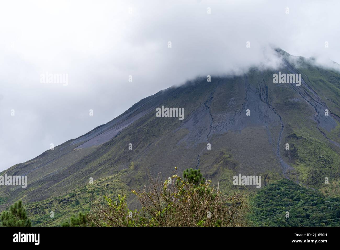 Beautiful cinematic aerial view of the Arenal Volcano in Costa Rica ...