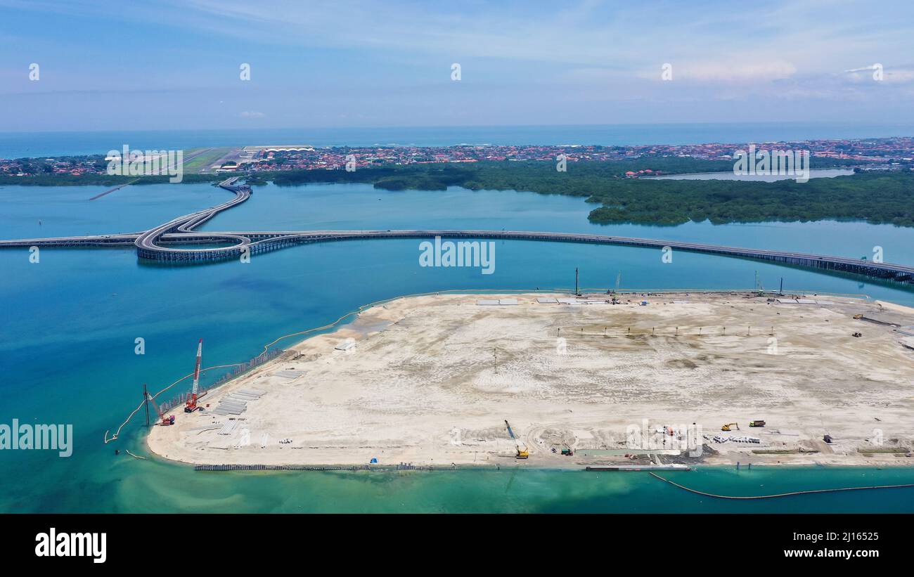 Aerial view of Bali Mandara toll road over sea. Car, motorbike bridge ...